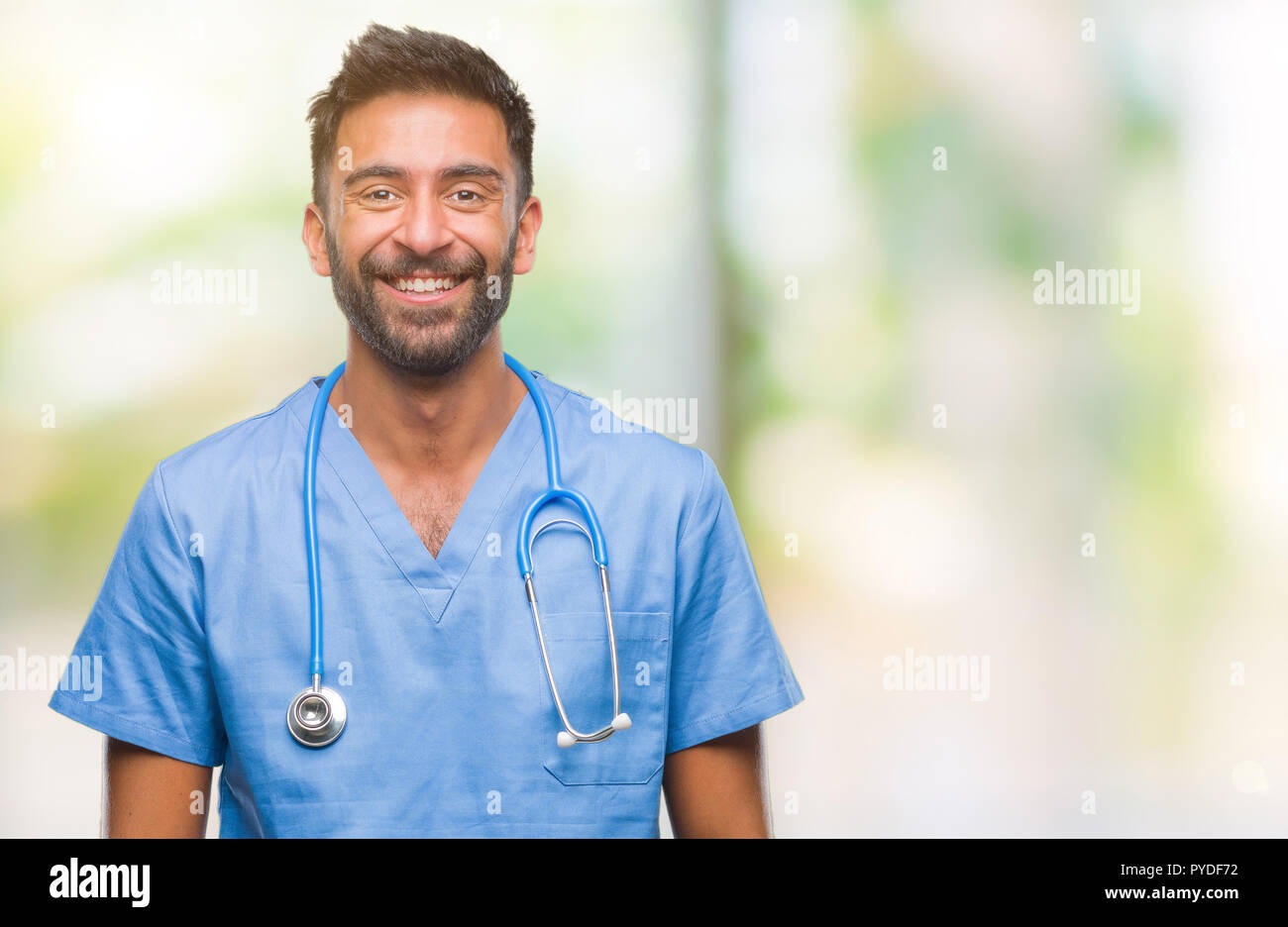 Adult hispanic doctor or surgeon man over isolated background with a ...