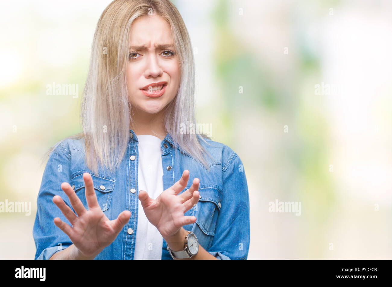 Young blonde woman over isolated background disgusted expression ...