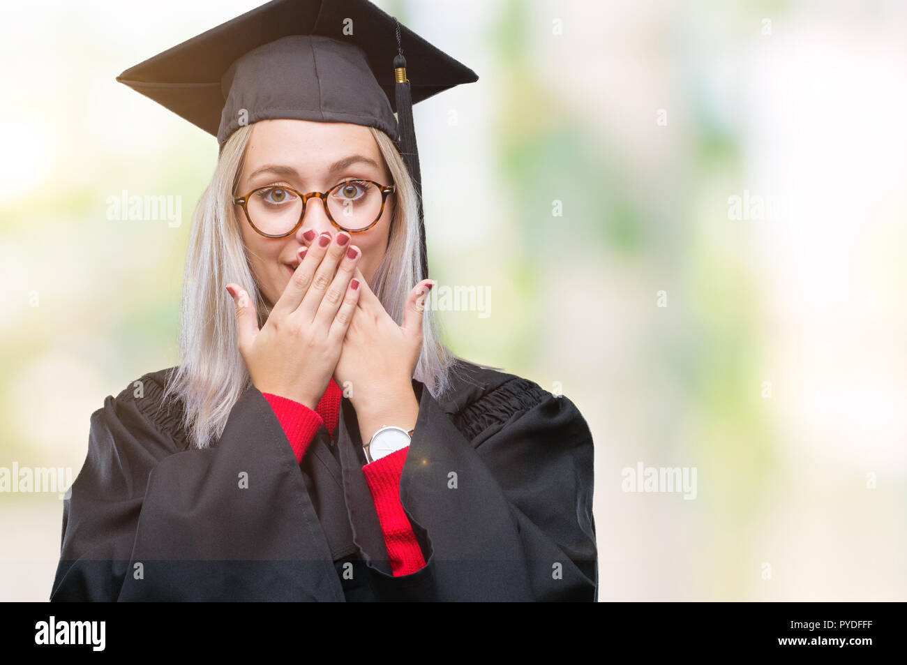 Young blonde woman wearing graduate uniform over isolated background ...