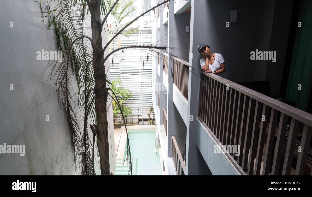 Girl looking on balcony hi-res stock photography and images - Alamy