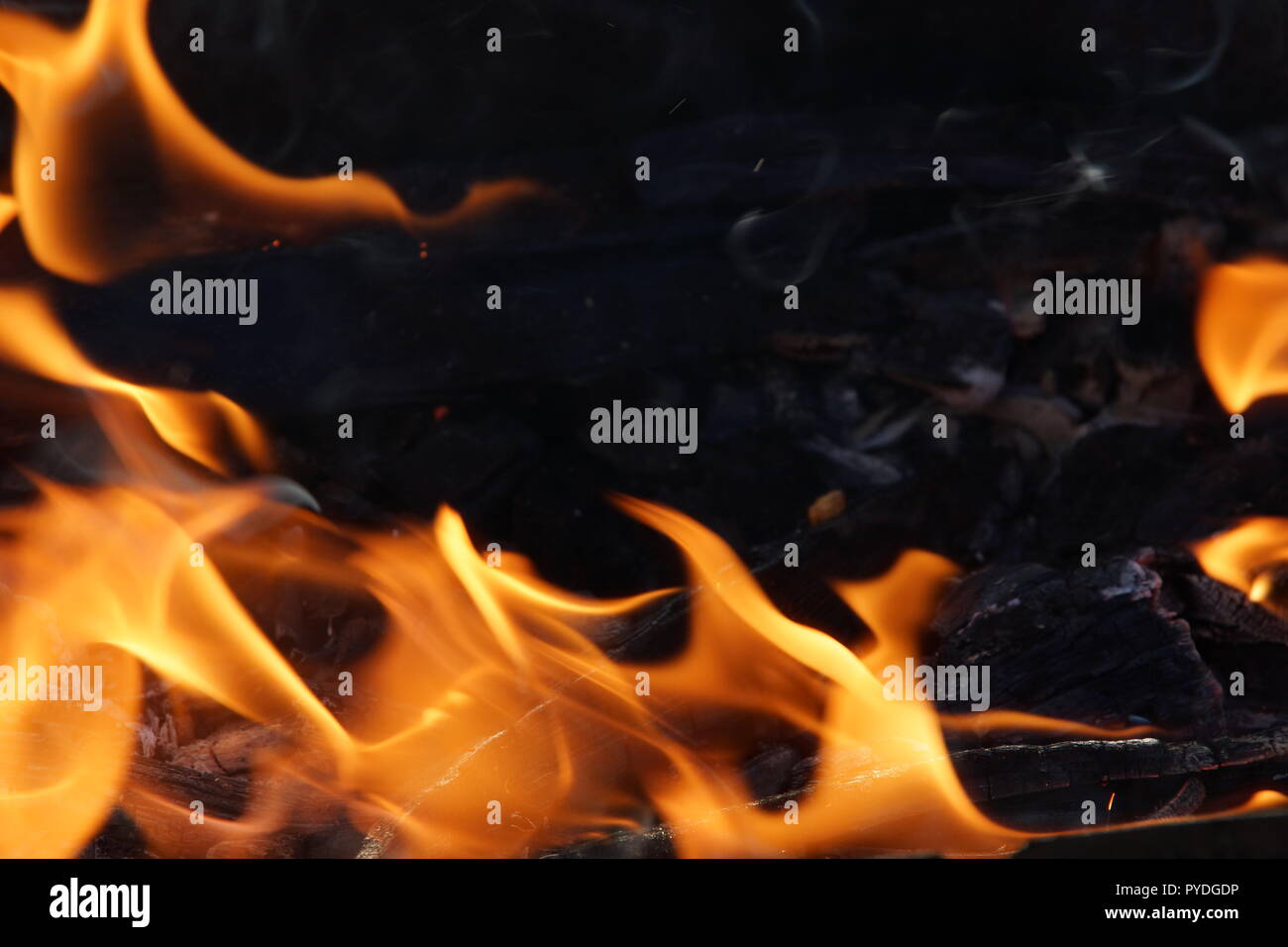 fire flame smoke embers to fry on the street close-up Stock Photo - Alamy