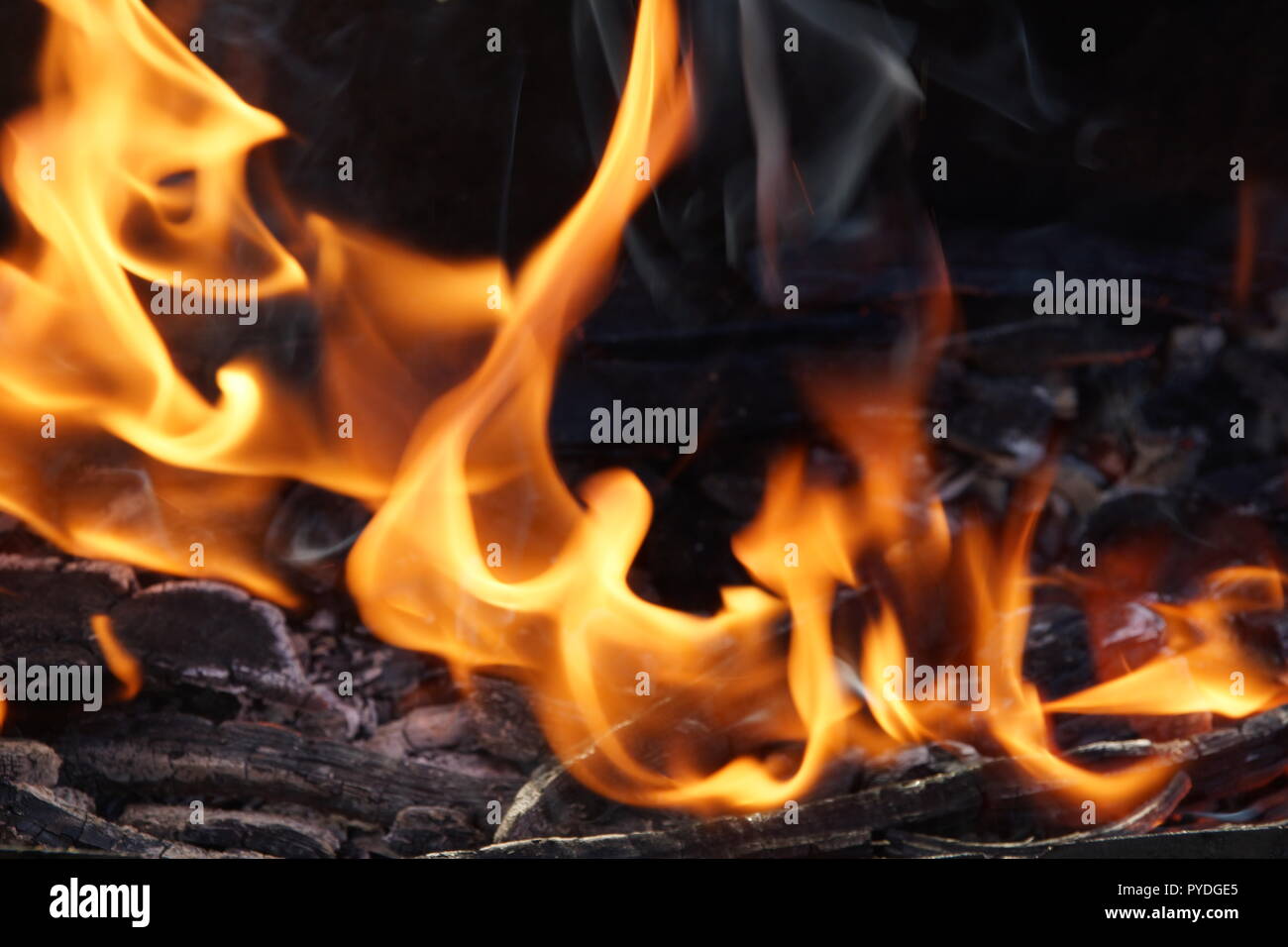 fire flame smoke embers to fry on the street close-up Stock Photo - Alamy