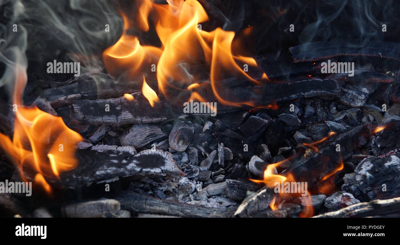 fire flame smoke embers to fry on the street close-up Stock Photo - Alamy