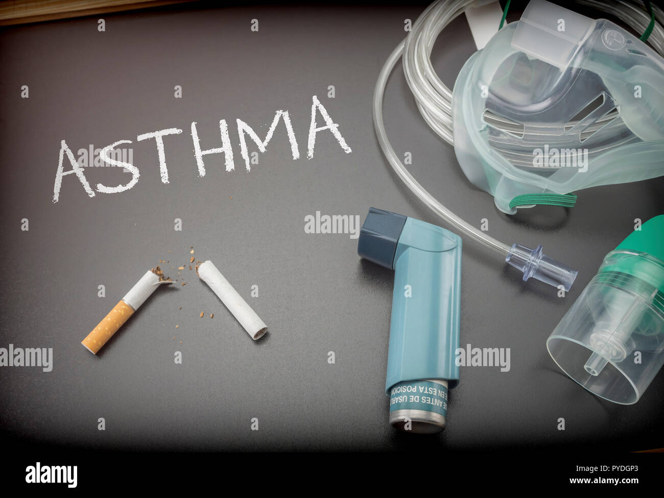 Word asthma written in chalk on a blackboard black next to a ...