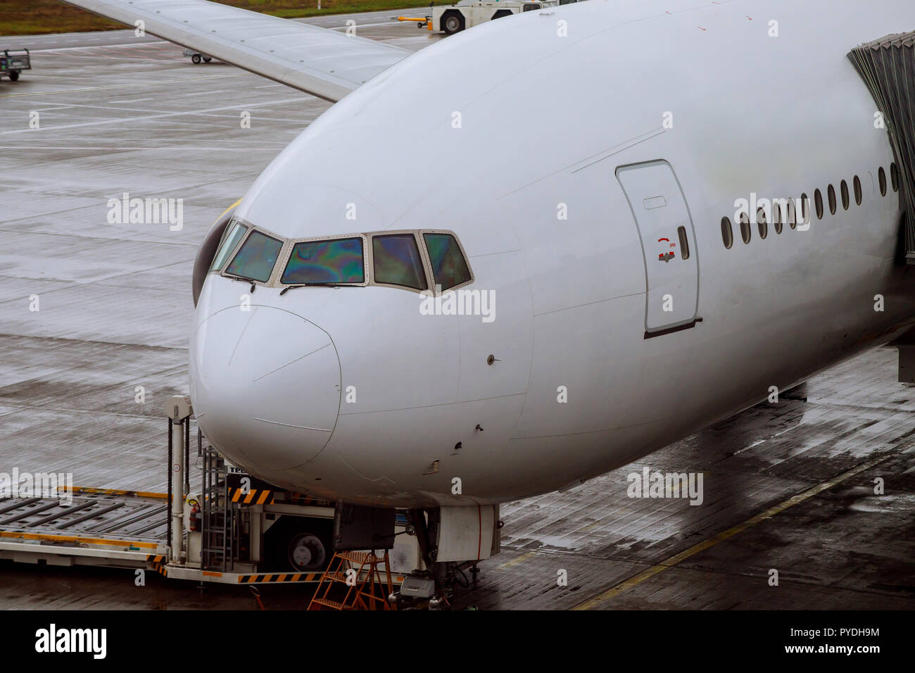 Airliner being prepared for boarding aircraft docked in airport loading ...