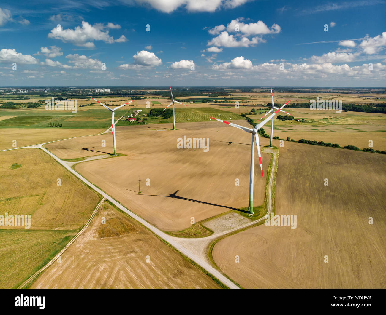 Aerial view of wind turbines generating power, located in Lithuania, on ...