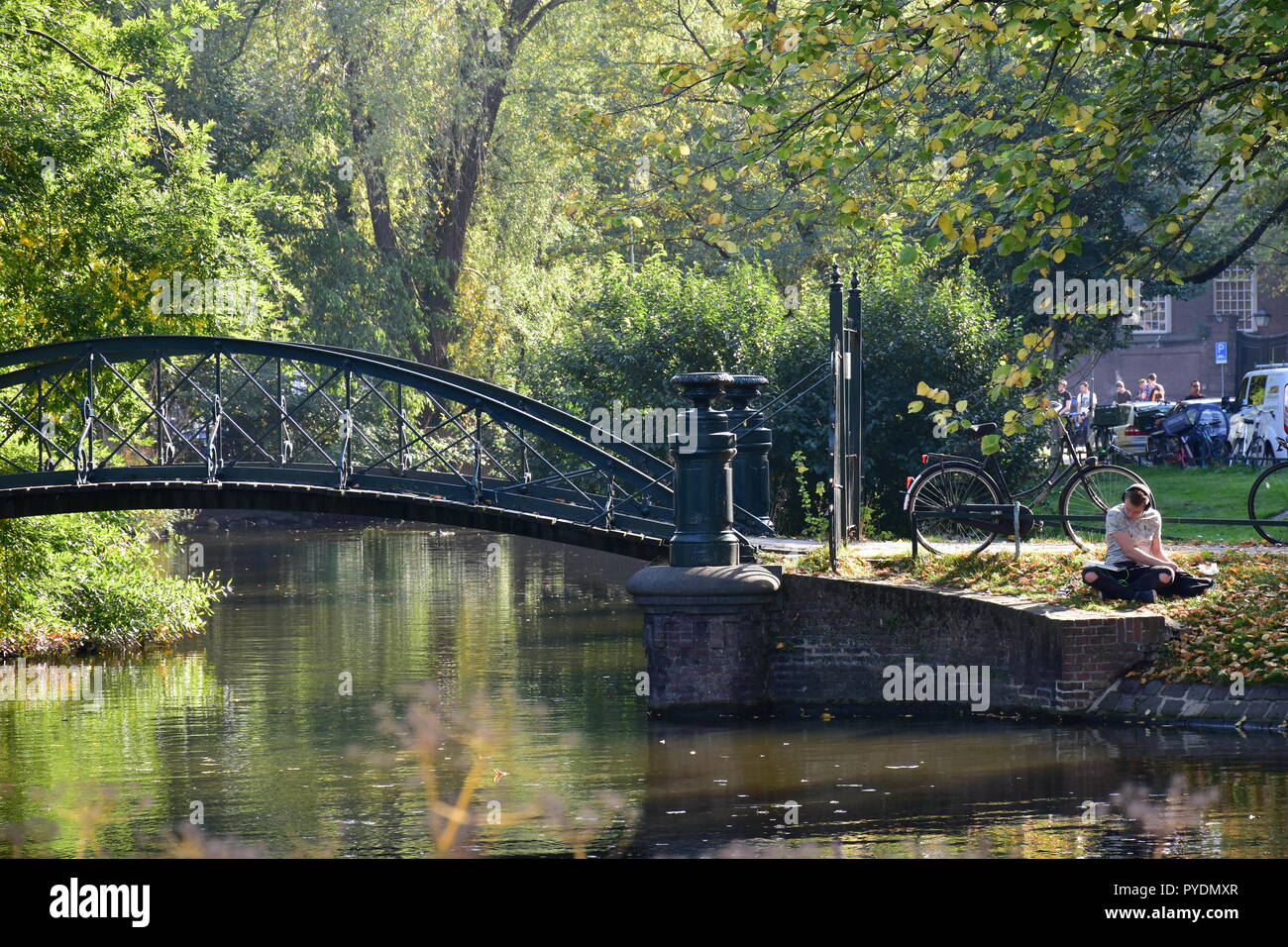 Student studying by a river Stock Photo - Alamy