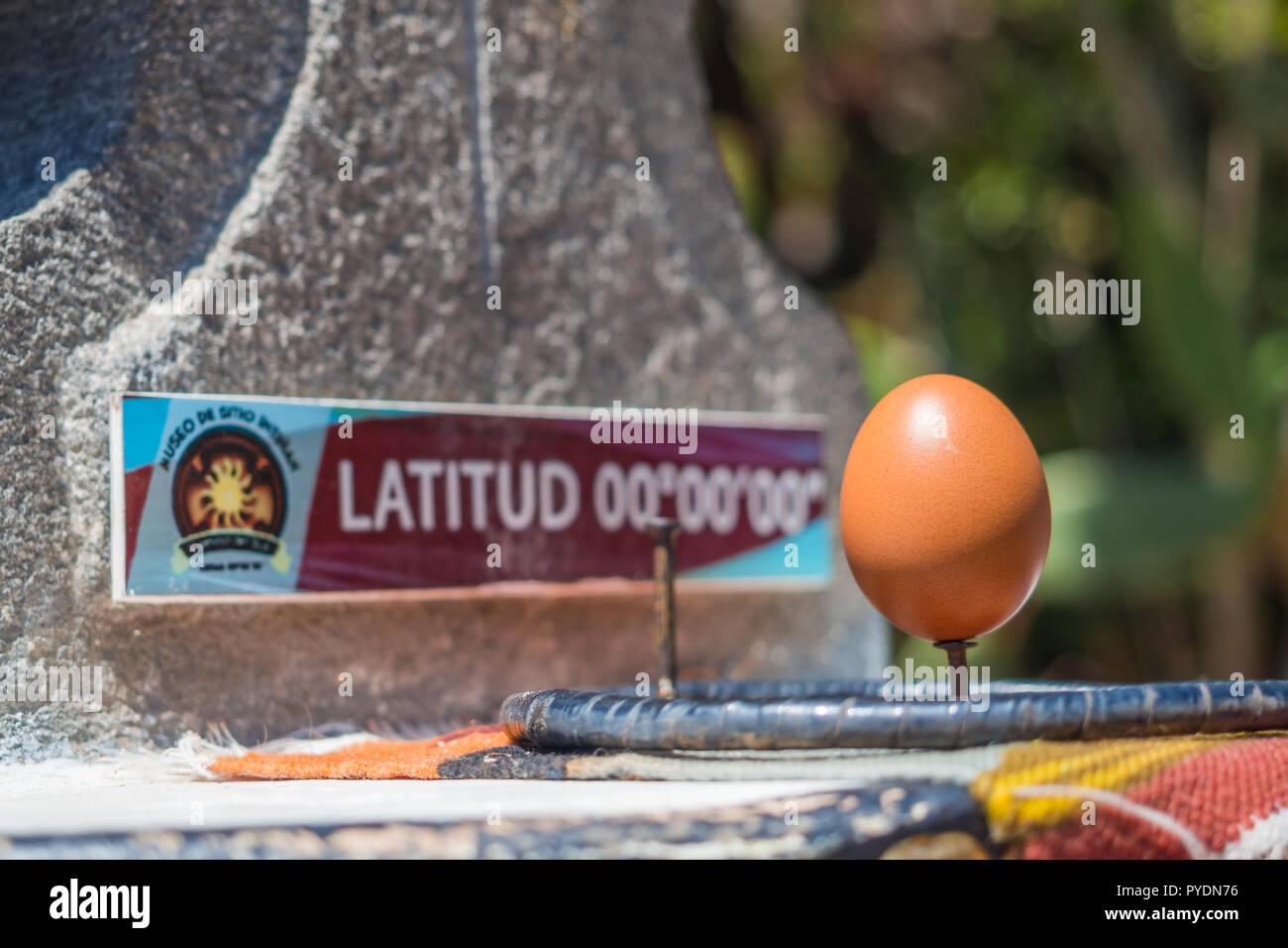Egg stand up in a nail in the middle of earth town in Ecuador. Equator ...