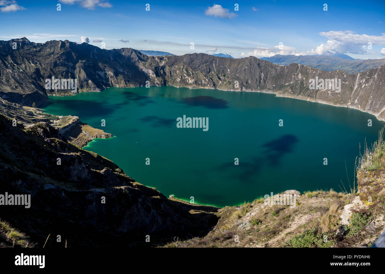 Panoramic of the volcano lake of Quilotoa, Ecuador. With a little kayak ...