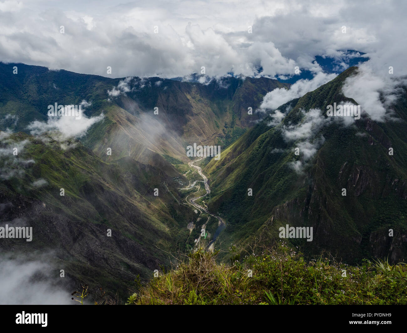 Panoramic view fron the top of Machu Picchu mountain, the river and the ...