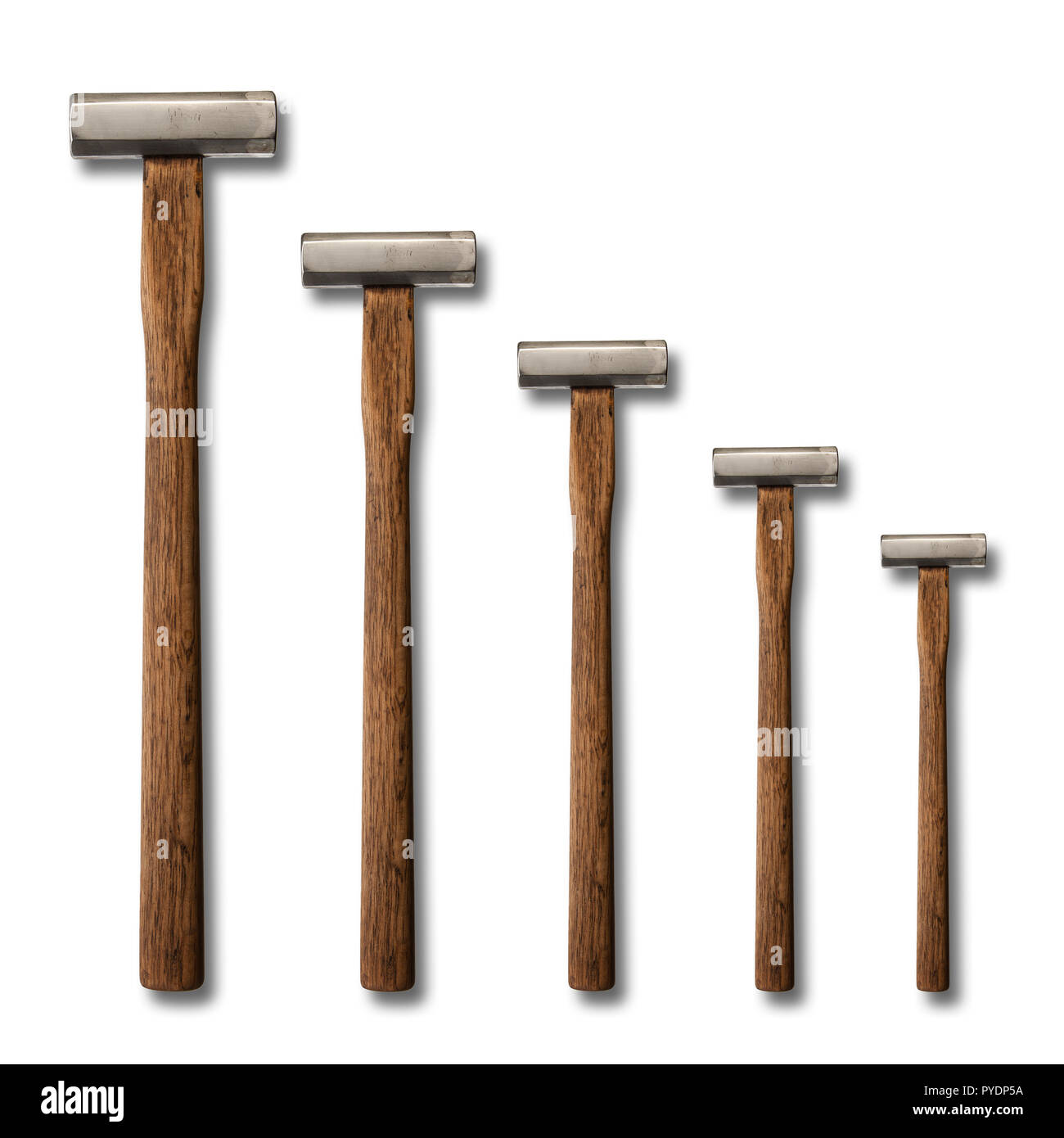 A selection of precision carpentry hammers on a white backdrop, with ...