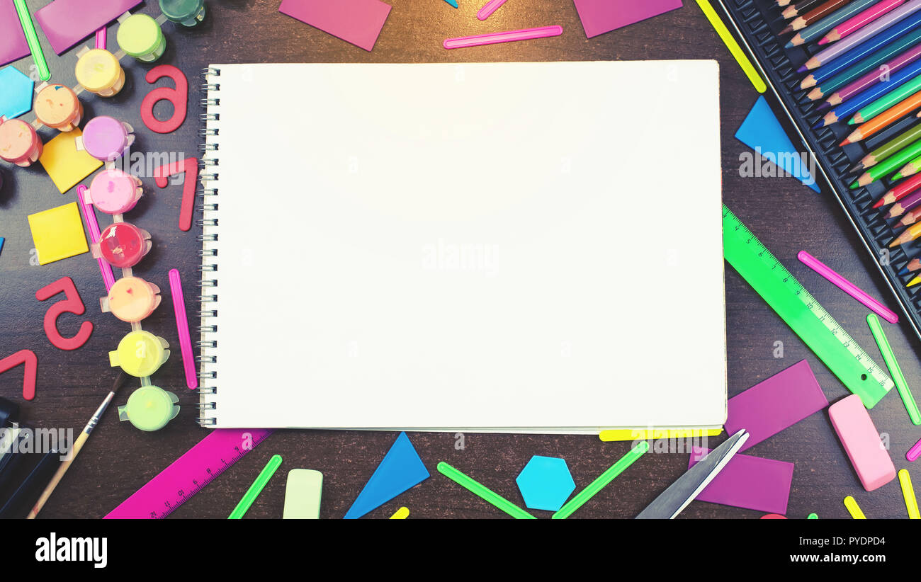 Banner A set of stationery for school notebook lying on the table. Top ...