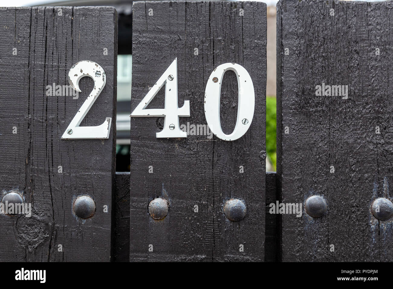 House number two hundred and forty 240 in cut out metal, weathered and ...