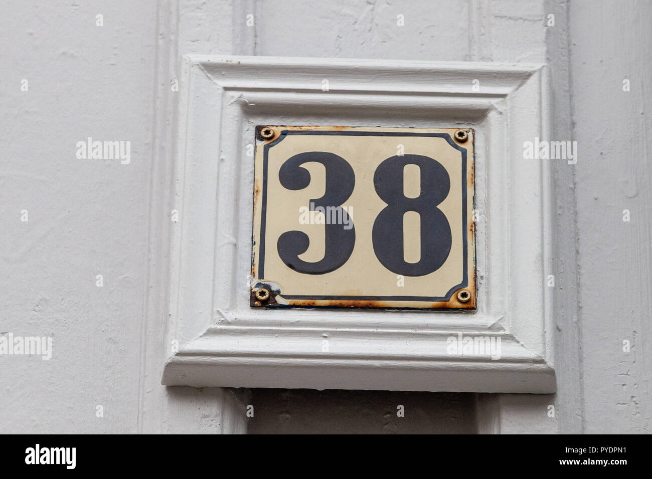 House number thirty-eight 38 in weathered and rusty metal painted cream ...