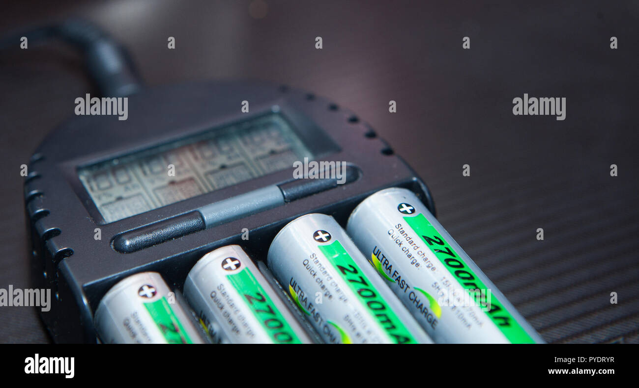 Close up of rechargeable lithium-ion battery with charger Stock Photo ...