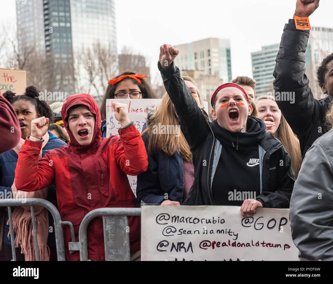 Group of young adults yelling and raising their fists at the 2018 March ...