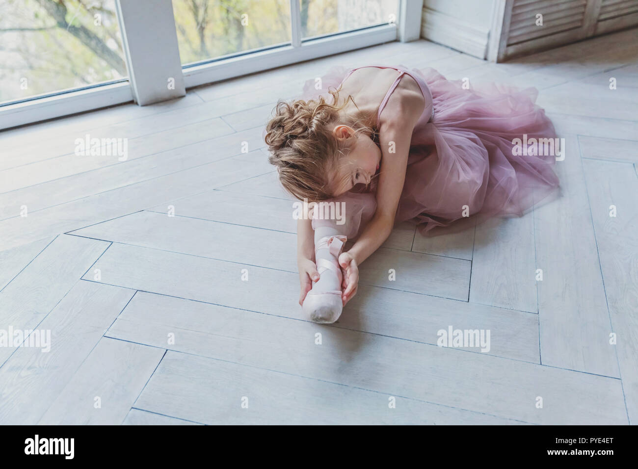 Young classical ballet dancer girl in dance class. Beautiful graceful ...