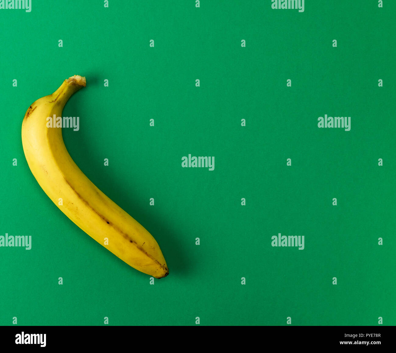 ripe yellow one banana on a green background, copy space Stock Photo ...