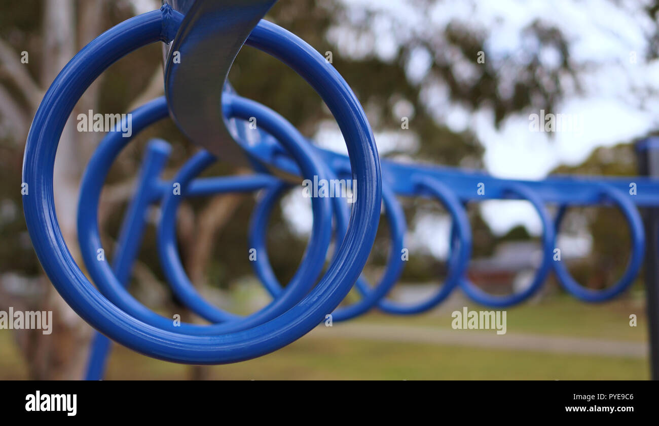 Blue gymnastic rings for kids at public park Stock Photo - Alamy