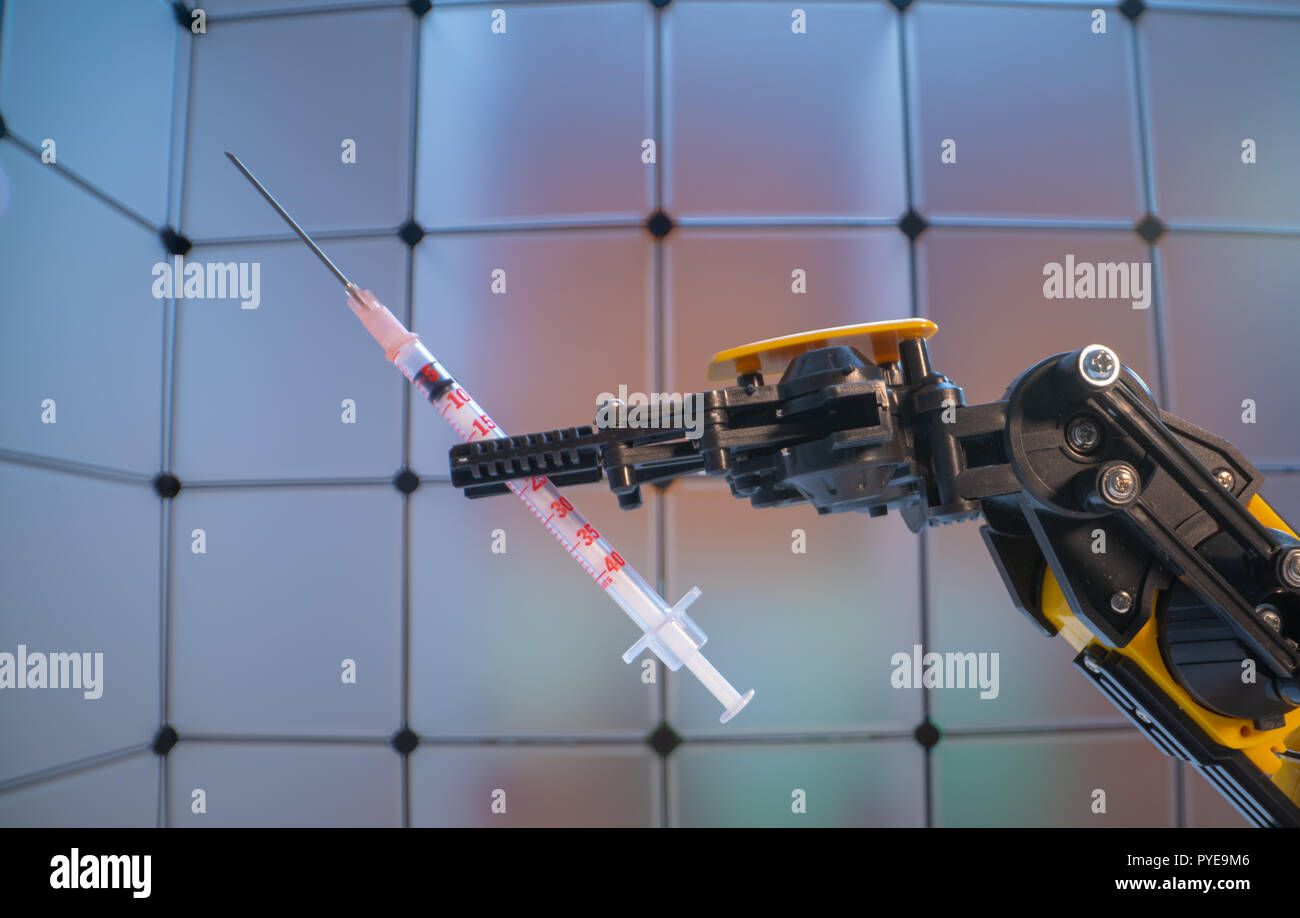 Medical syringe in the robot arm, Model of industrial robot manipulator ...