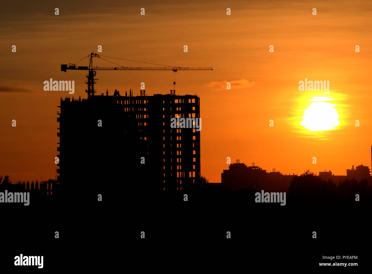 Building silhouette on sunset with cityscape on the background Stock ...