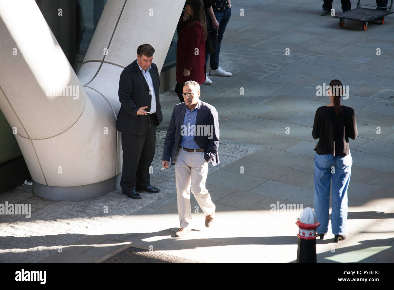 smoker, smokers, smoking during break, outside building in central ...