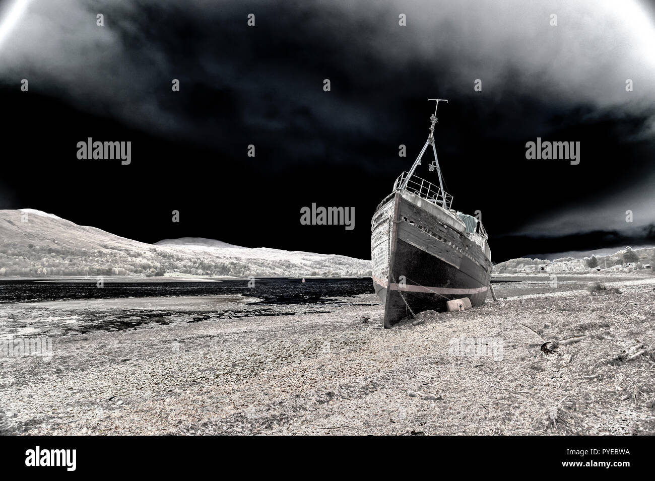 Abandoned in shore fishing boat at Corpach on the beach of Loch Linnhe ...