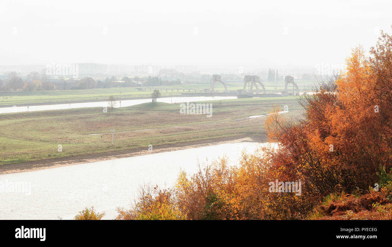 The beautiful river landscape of the river Nederrijn at the Driel dam ...