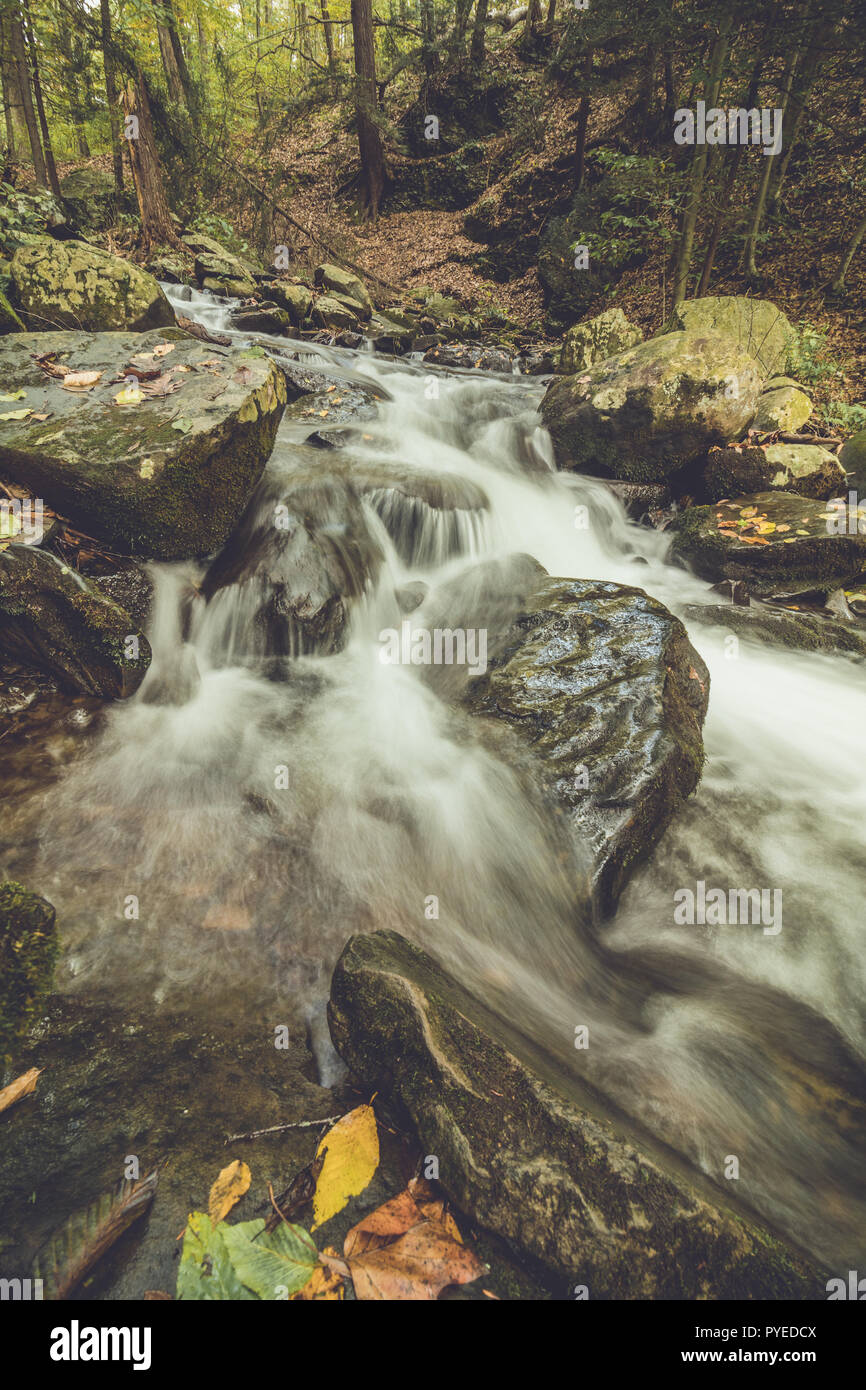 Bushkill Falls in Poconos, PA, surrounded by lush fall foliage Stock ...