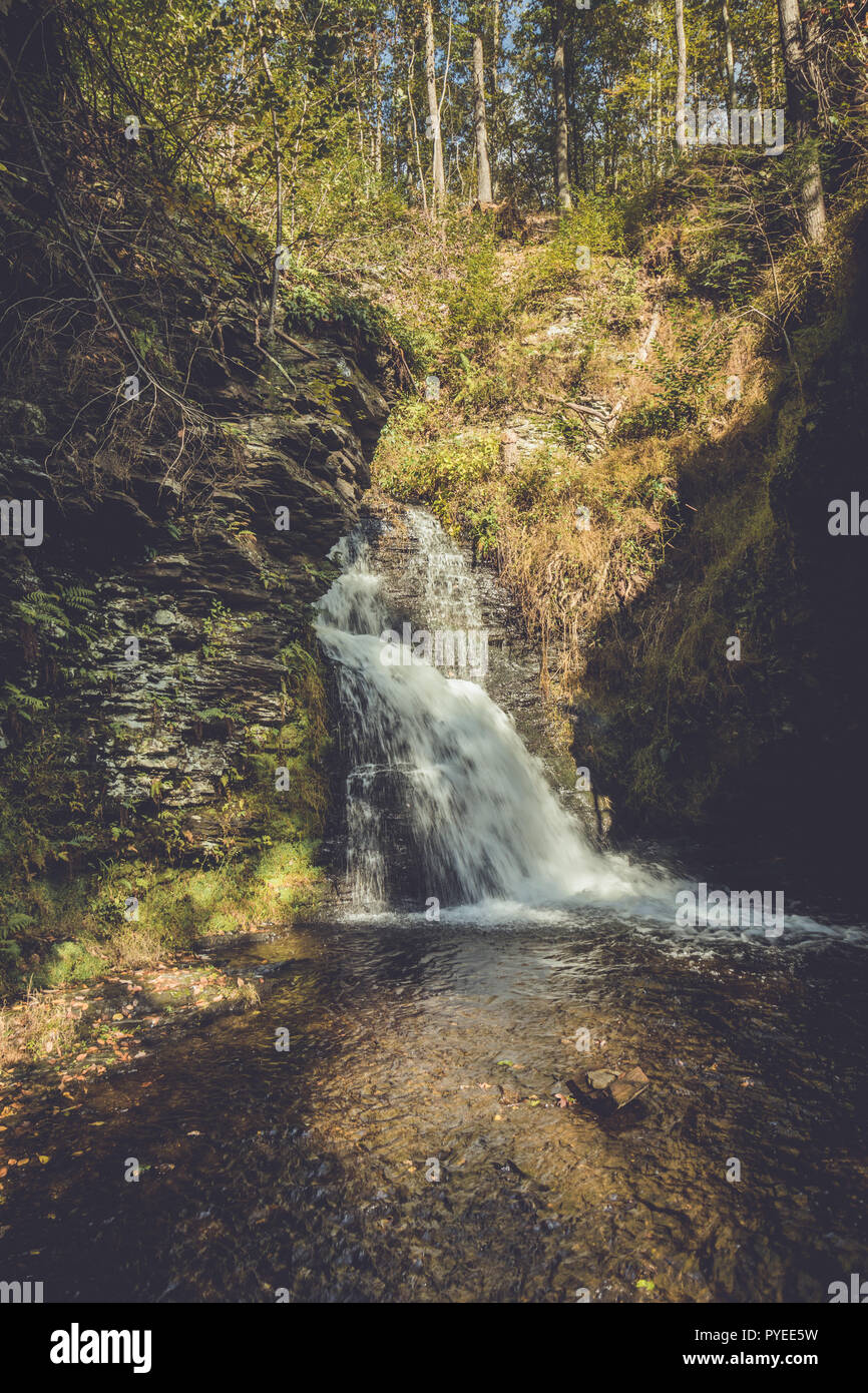Bushkill Falls in Poconos, PA, surrounded by lush fall foliage Stock ...
