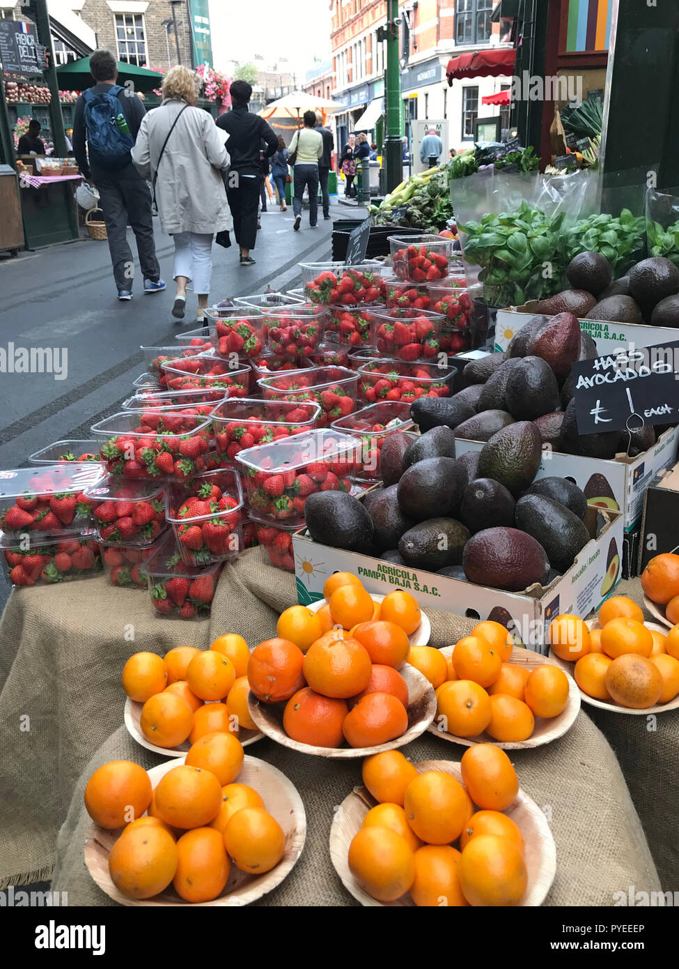 London, UK - October 19, 2018: People walking past a beautiful fruit ...