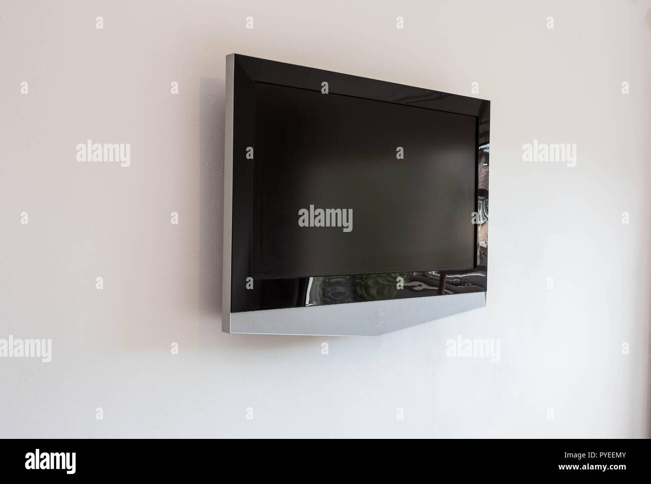 Black LED tv television screen mockup mock up, blank on white wall ...
