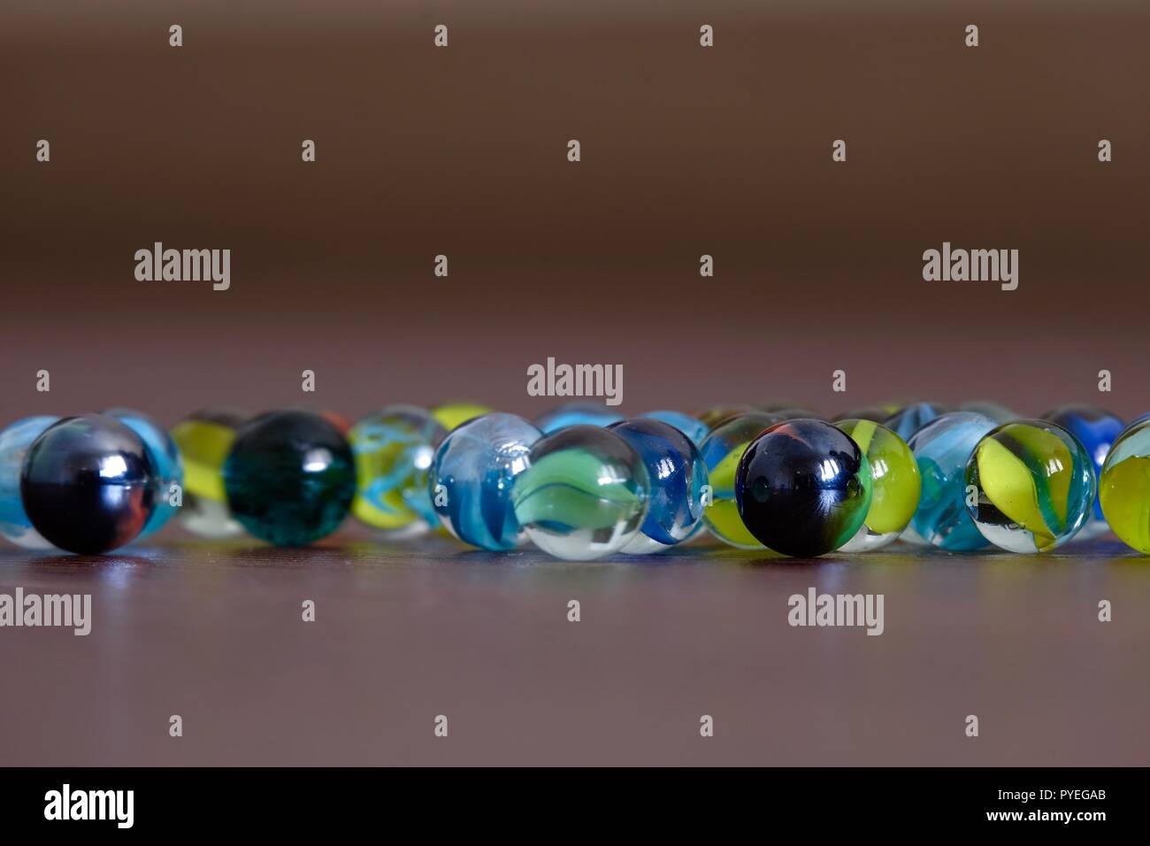 Glass colourful Marbles game Stock Photo - Alamy