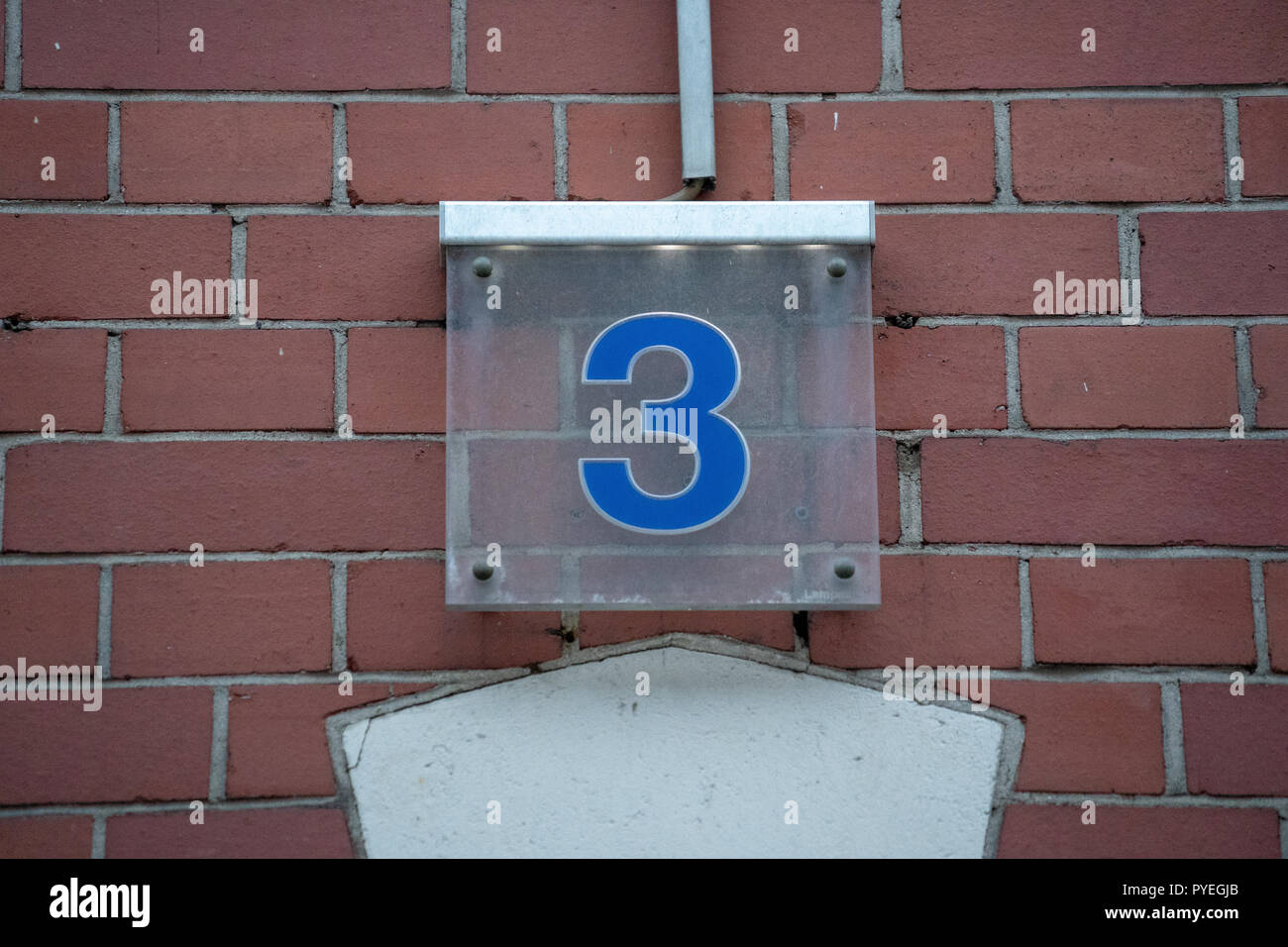 House Number with Digit 3 on a Wall in the Background Stock Photo - Alamy