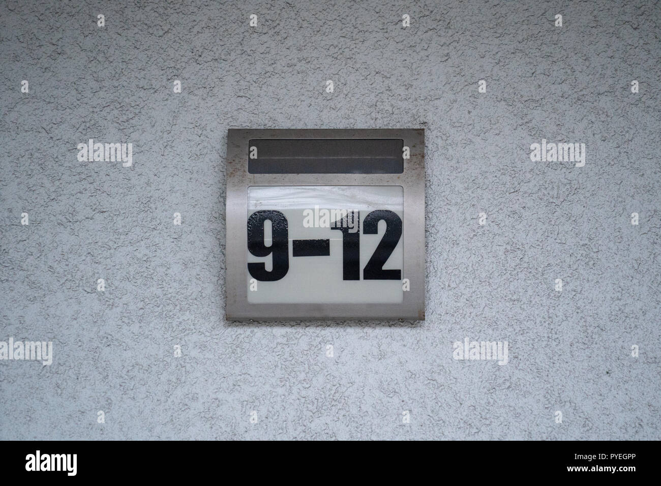 House Number with Digit 9 to 12 on a Wall Stock Photo - Alamy