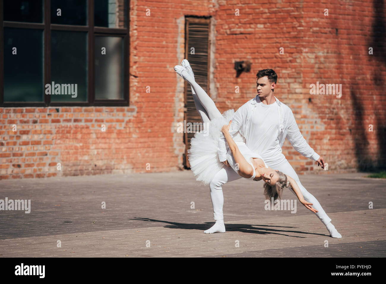 beautiful young ballet dancers practicing on urban city street Stock ...