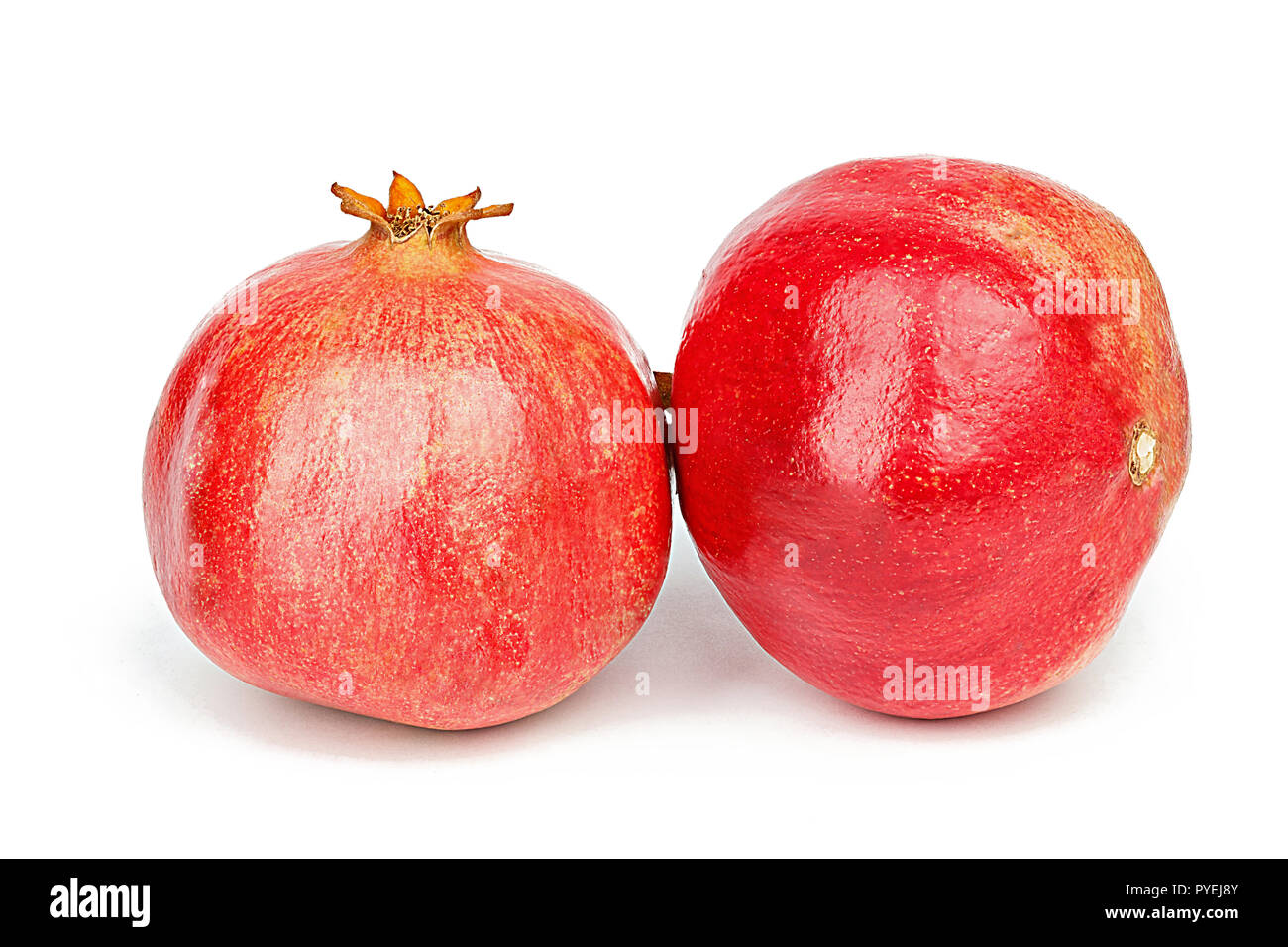 two whole pomegranate fruits isolated on white background Stock Photo ...