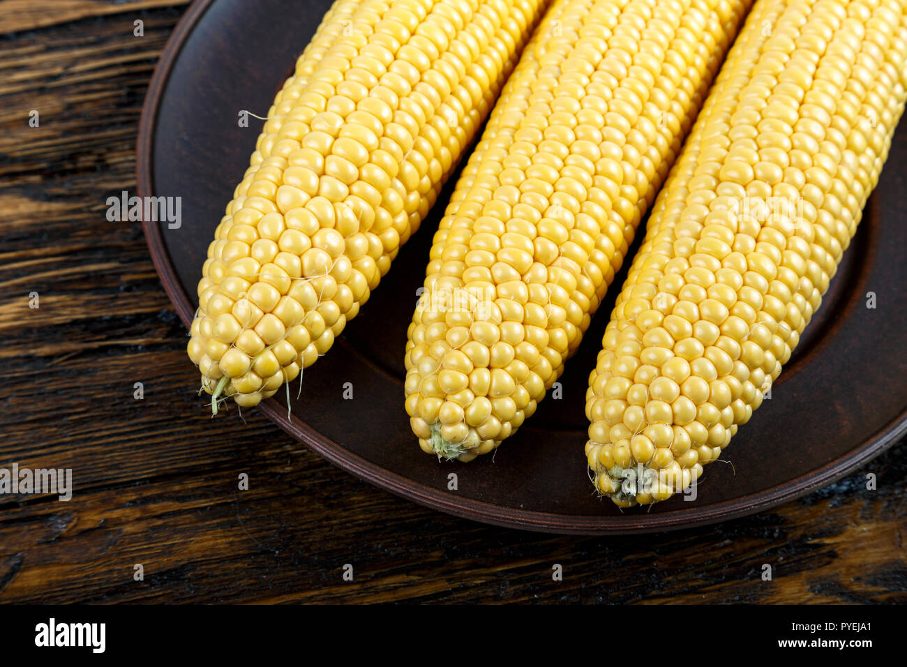 corn crop lying in a plate. Top view Stock Photo - Alamy