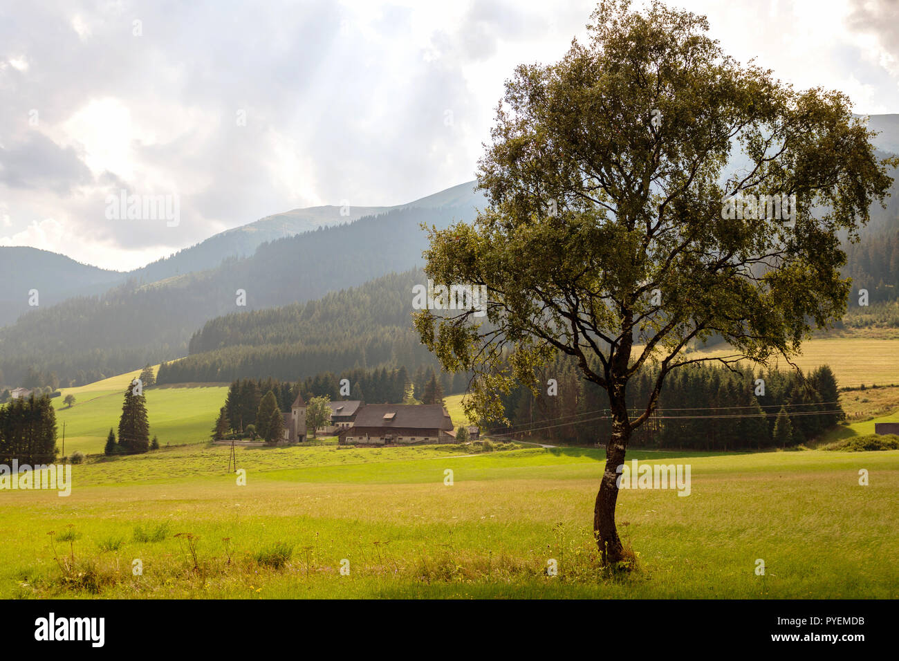 A typical small Austrian village at the foot of the Alpine mountains ...