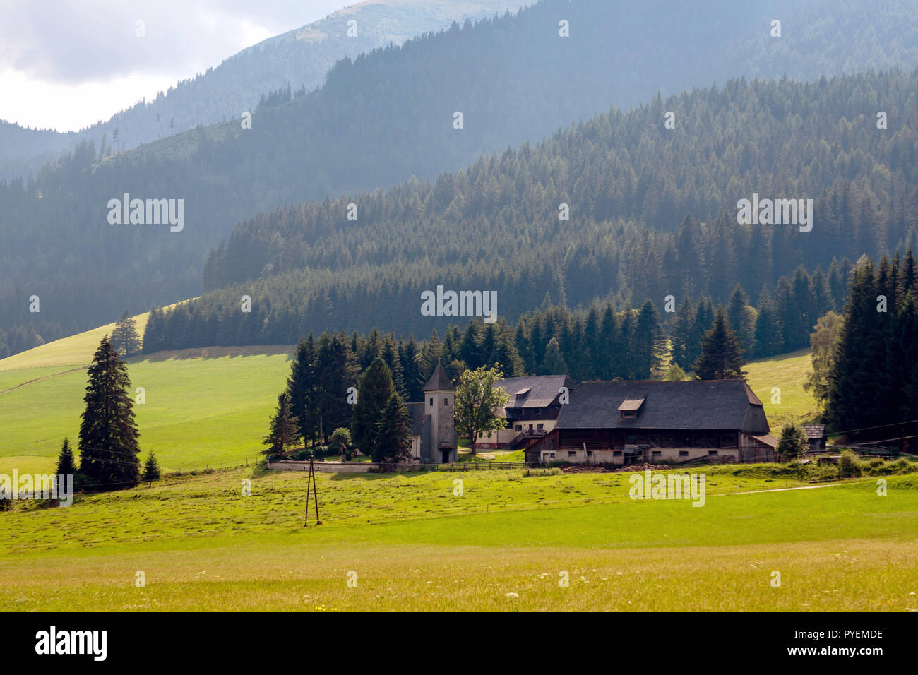 A typical small Austrian village at the foot of the Alpine mountains ...