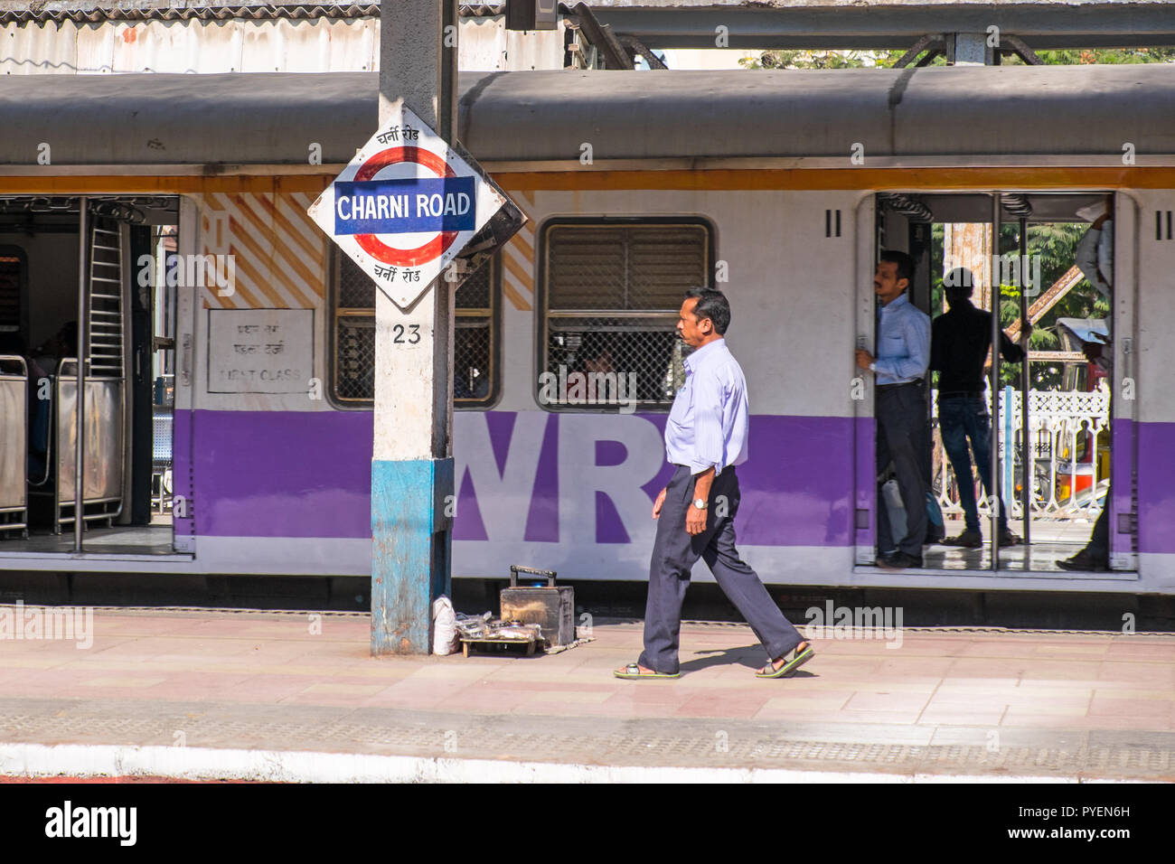 Suburban commuter train at the platform, Charni Road, Mumbai,India ...