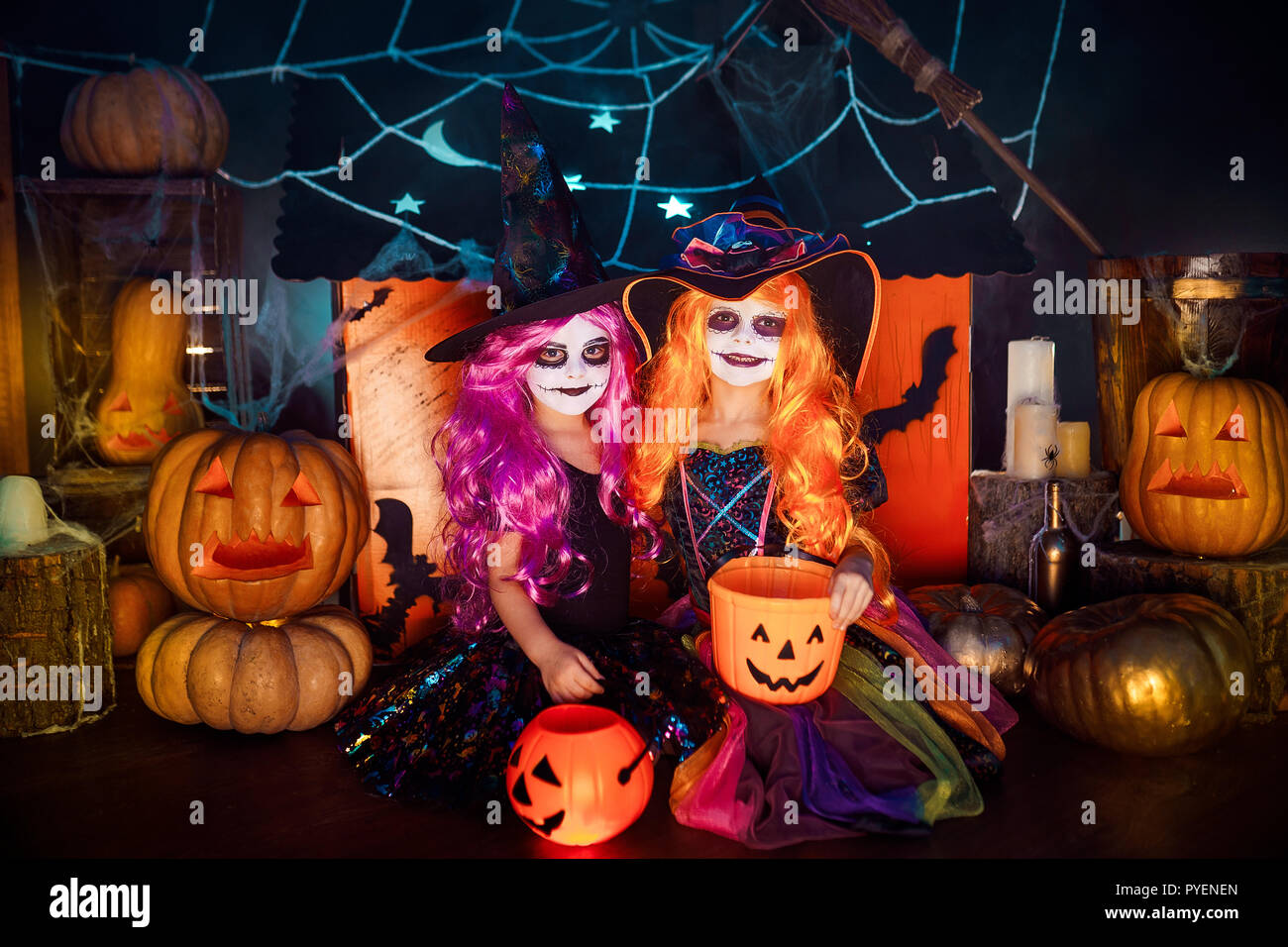 Two cute funny sisters celebrate the holiday. Jolly children in ...