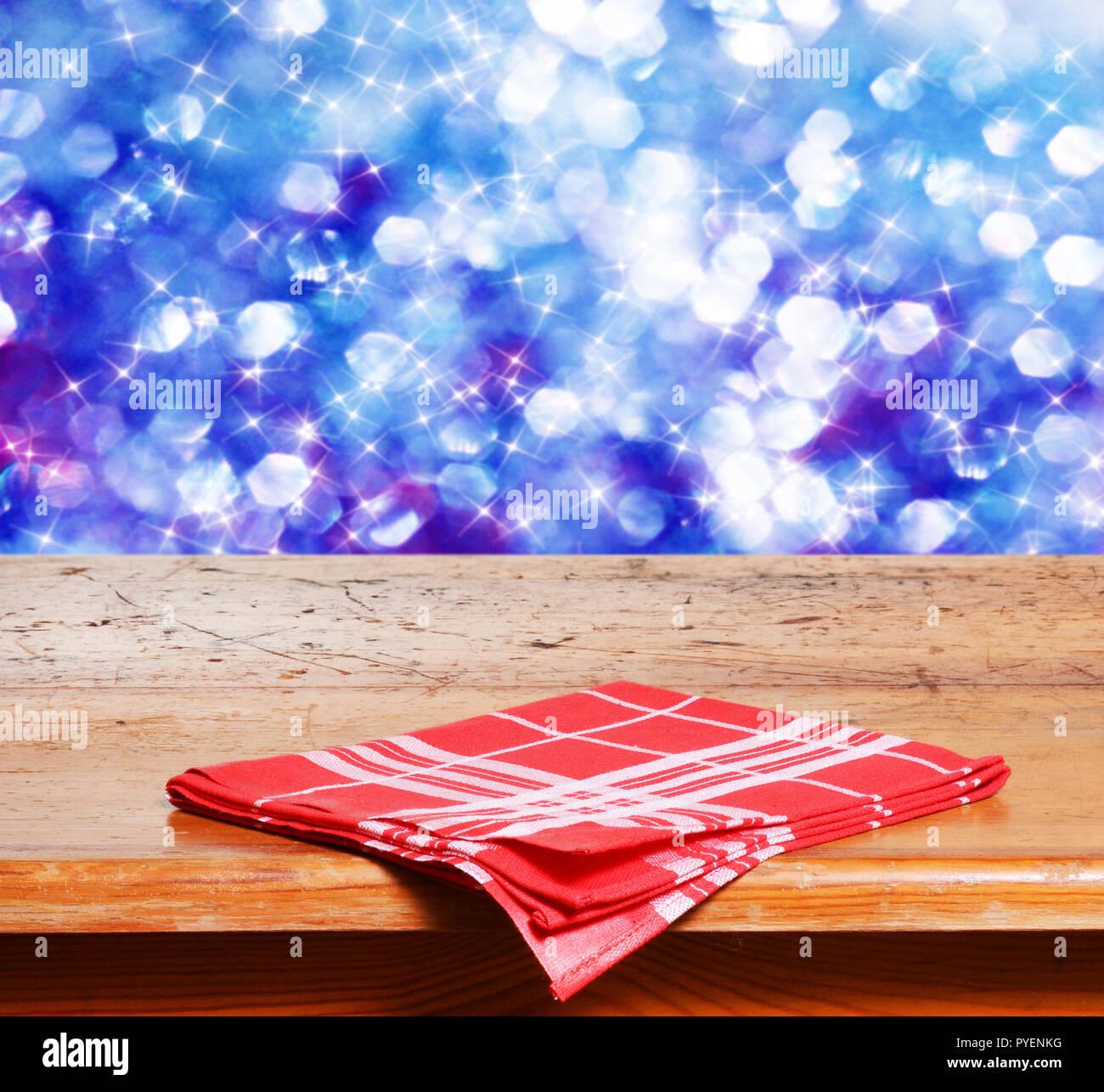 Empty wooden table and christmas lights in background Stock Photo - Alamy