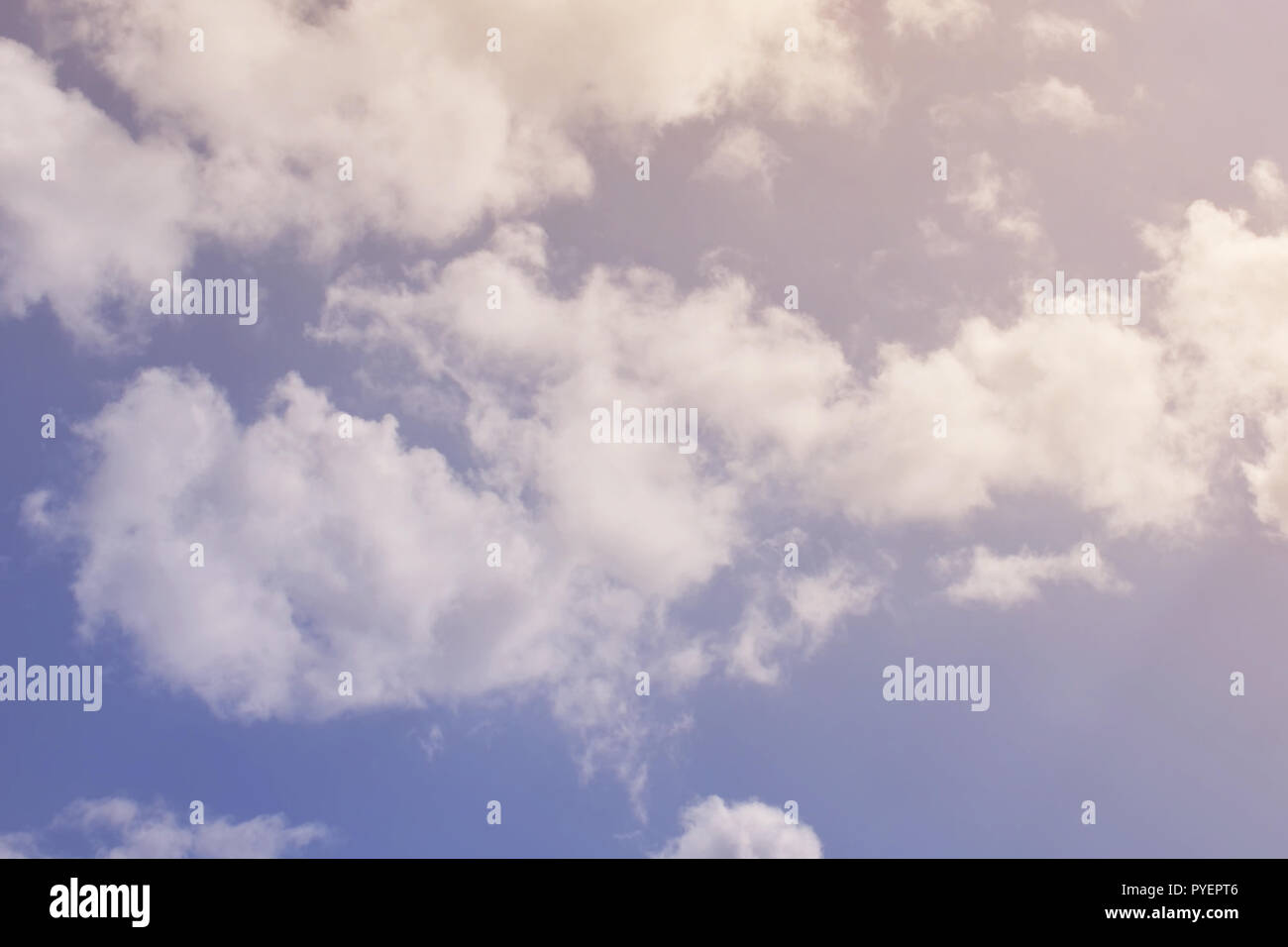 Nature background. Fluffy soft clouds in sky toned Stock Photo - Alamy