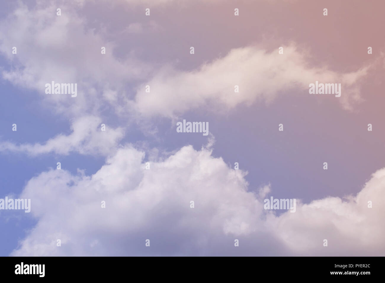 Nature background. Fluffy soft clouds in sky toned Stock Photo - Alamy