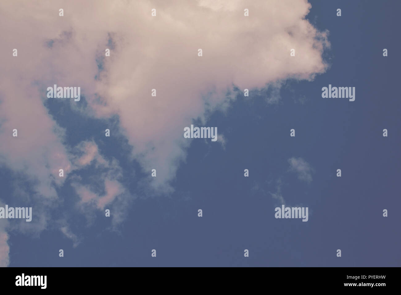 Nature background. Fluffy soft clouds in sky toned Stock Photo - Alamy