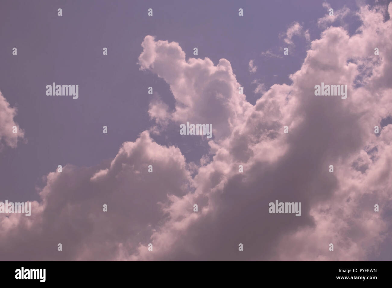 Nature background. Fluffy soft clouds in sky toned Stock Photo - Alamy