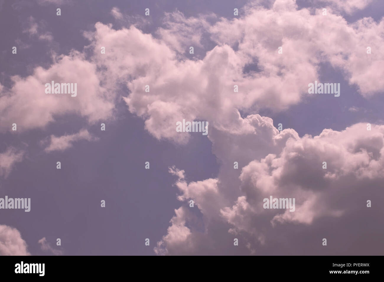 Nature background. Fluffy soft clouds in sky toned Stock Photo - Alamy