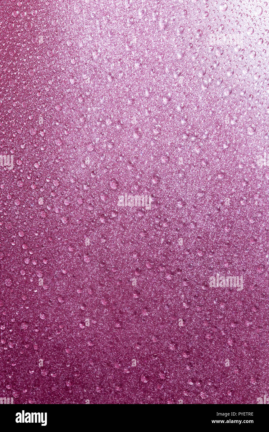 abstract background with drops on pink glitter surface Stock Photo - Alamy