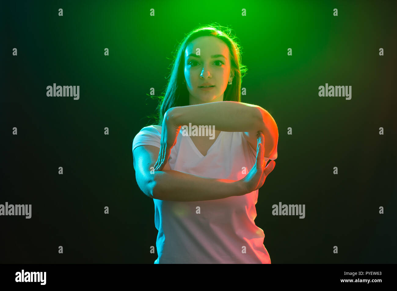 Young athletic female dancing street dance in studio Stock Photo - Alamy